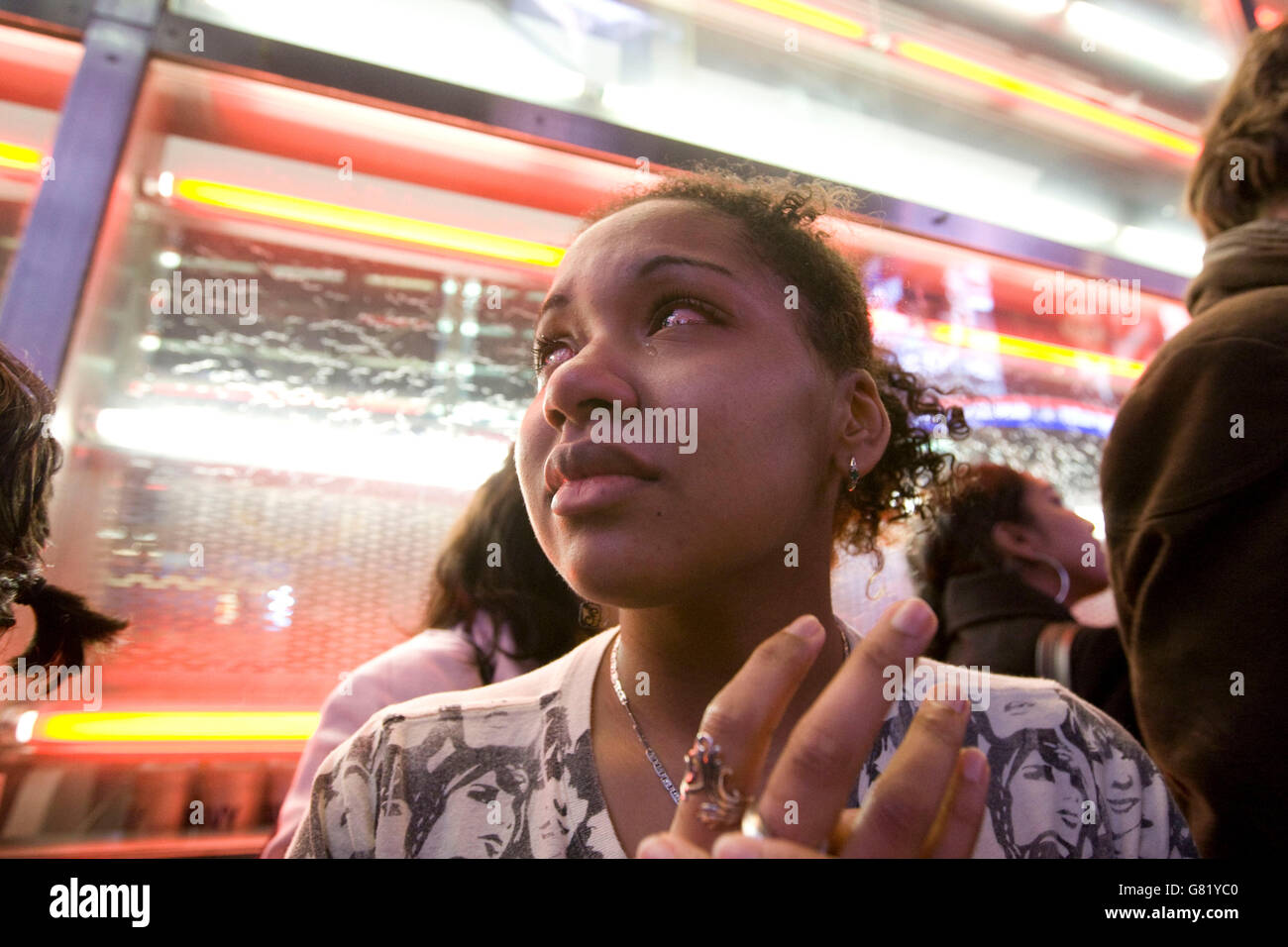 People listen to Barack Obama's acceptance in the 2008 US presidential ...