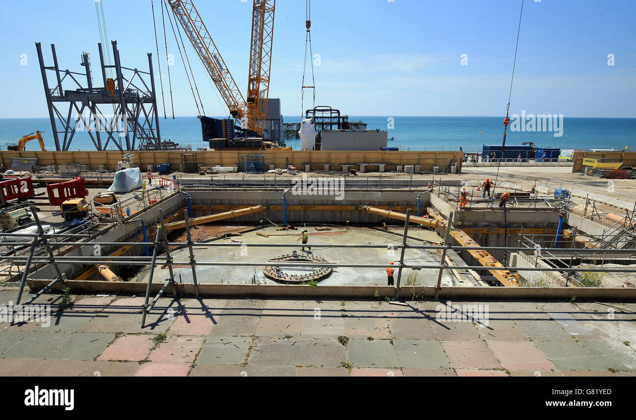 A general view of the construction site, as a barge carrying components ...