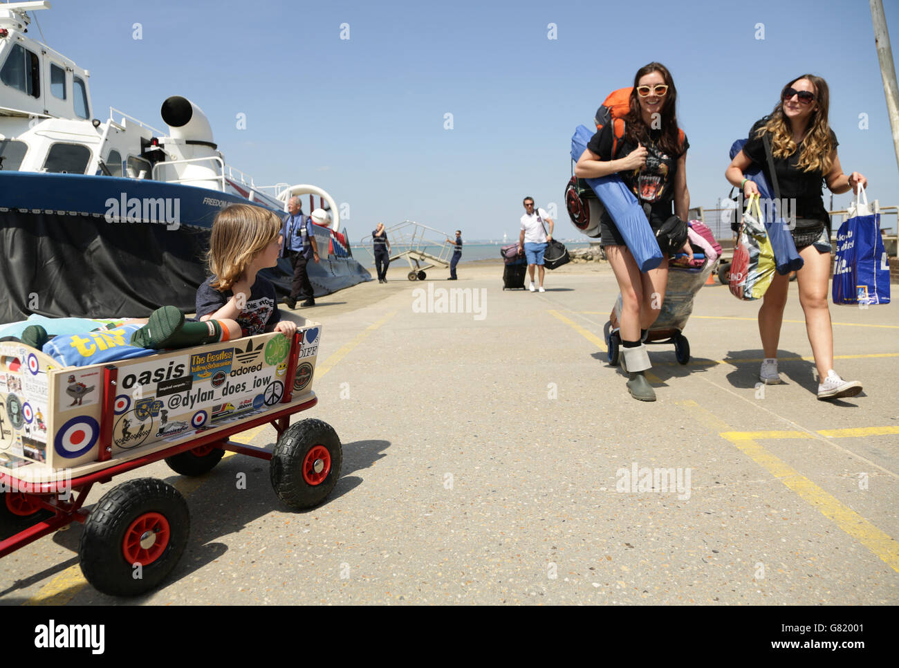 Festival goer Dylan Porter, two, from Portsmouth, is pulled along in a ...