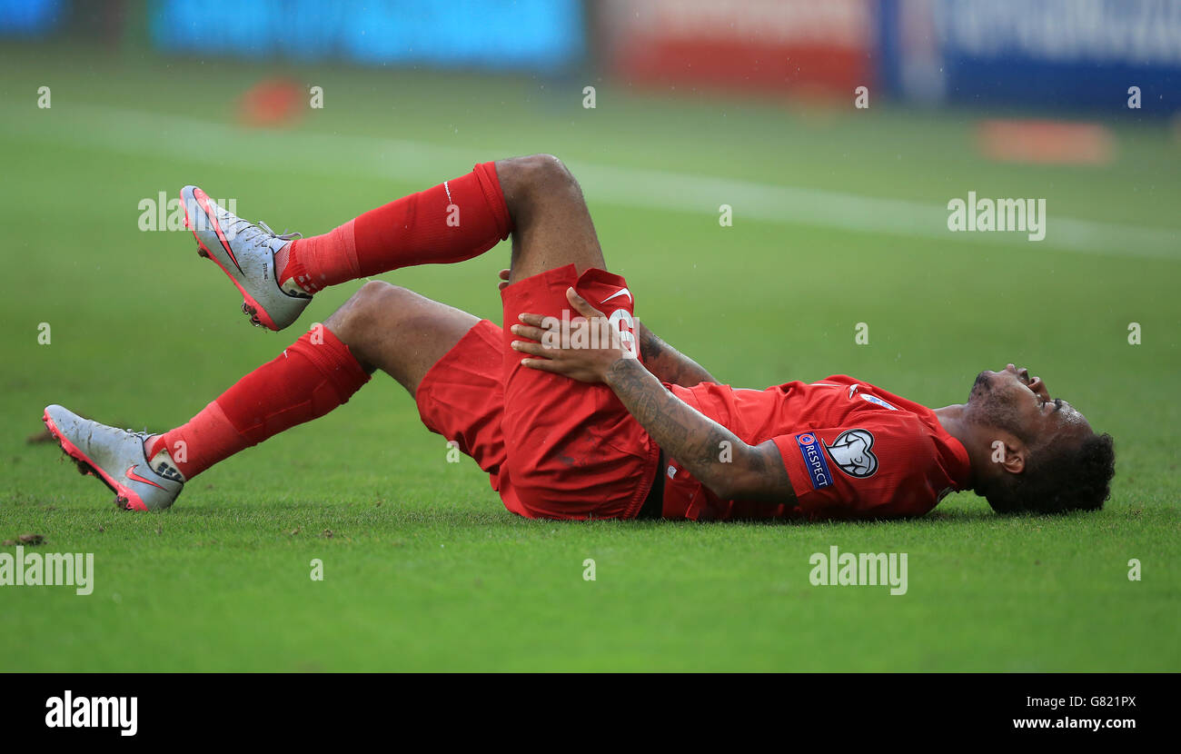 England's Raheem Sterling holds his leg on the ground during the UEFA ...