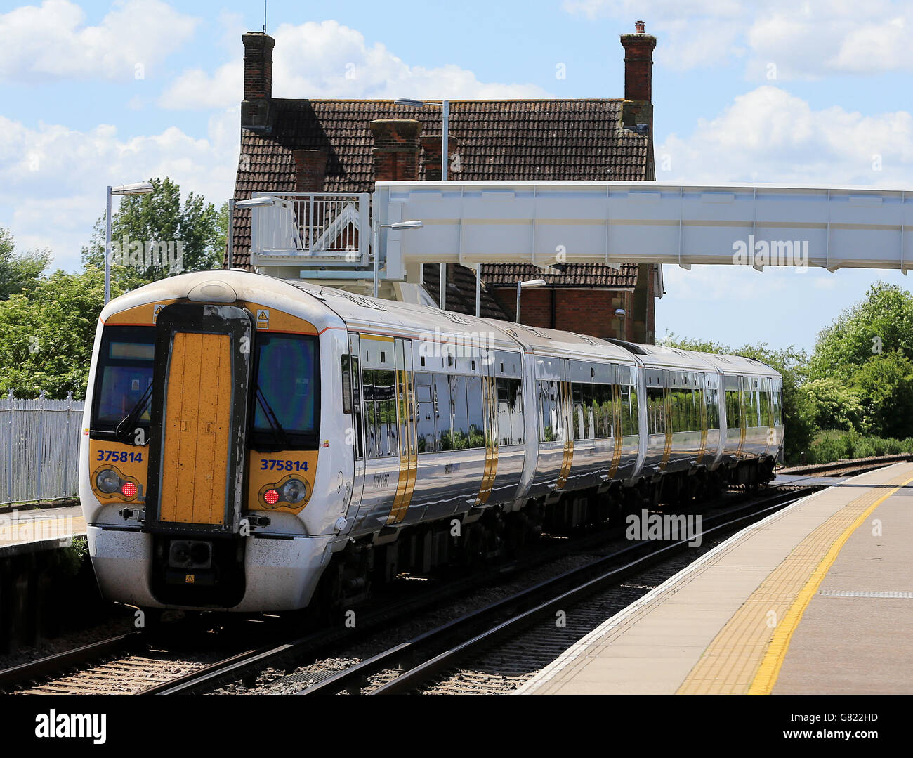 Rail stock. A Southeastern train passes through Wye Station in Kent ...