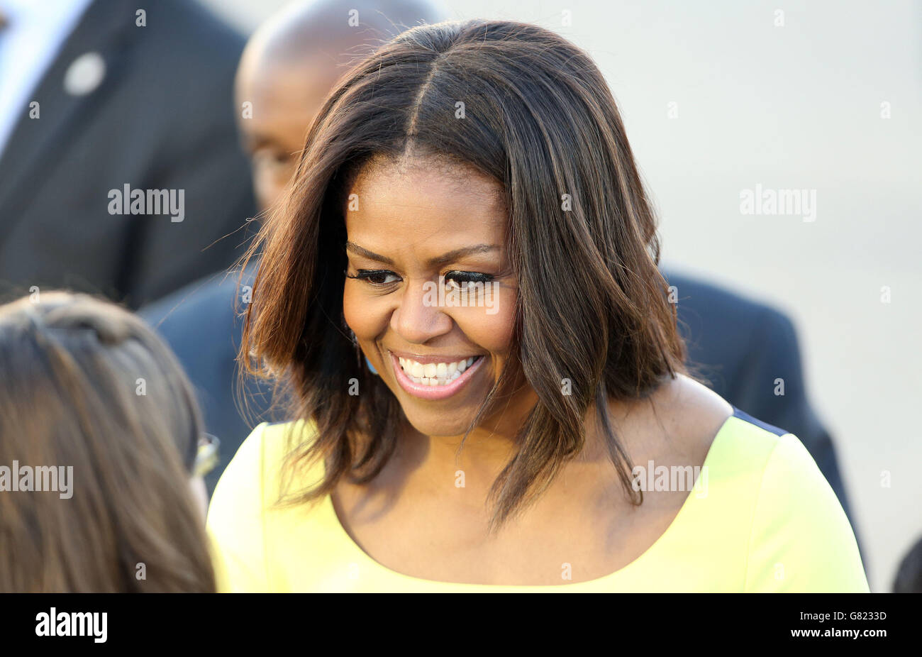 US first lady Michelle Obama smiles as she arrives at Stansted Airport ...