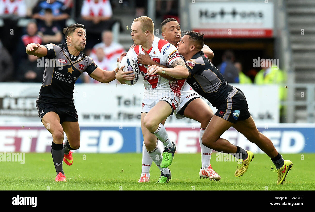 St Helens' Adam Swift is tacked by Salford Red Devils' Rangi Chase ...