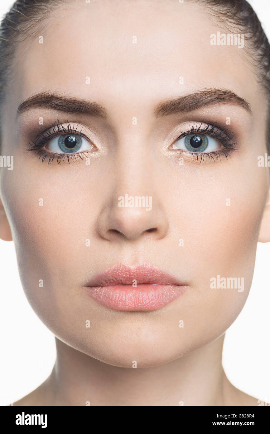 Portrait of beautiful woman against white background Stock Photo - Alamy