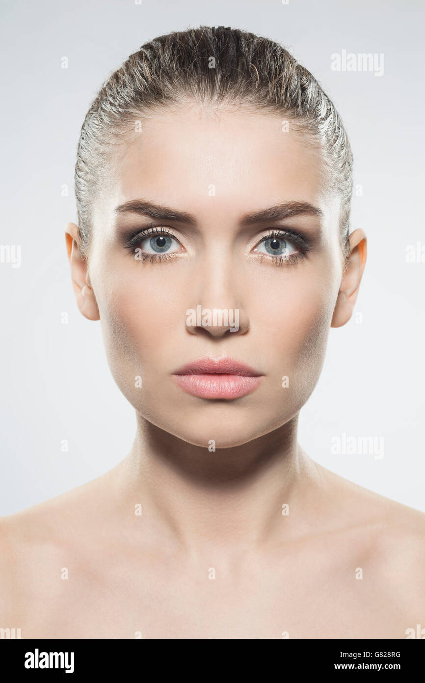 Portrait of beautiful woman against white background Stock Photo - Alamy