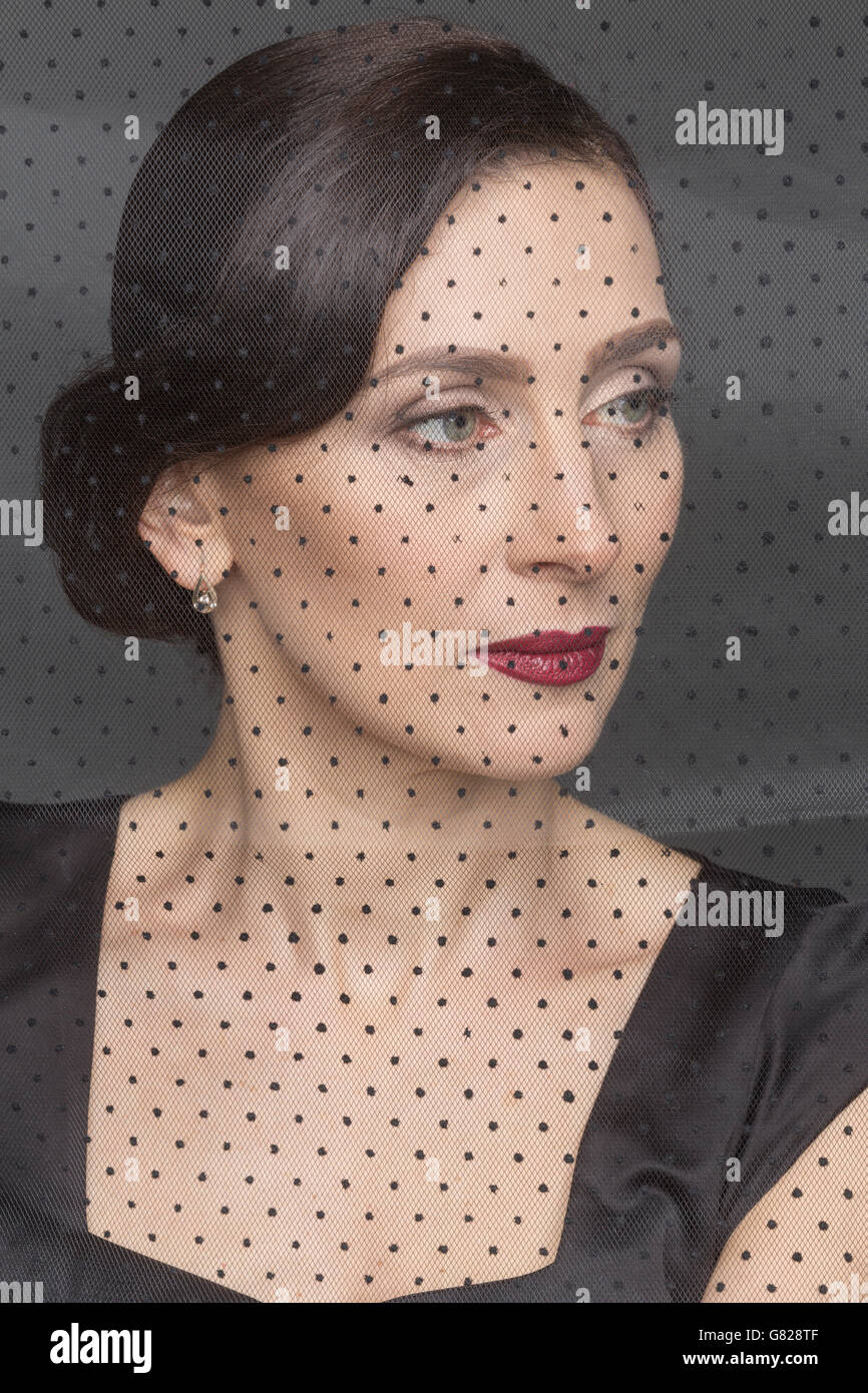 Close-up of beautiful woman seen through net Stock Photo - Alamy