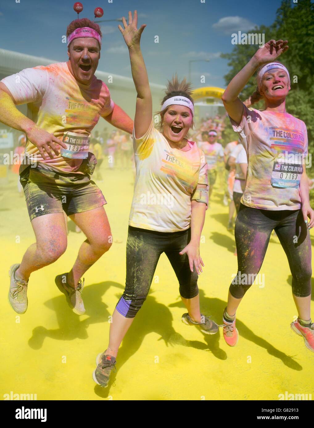 Runners covered in colourful powder during the Color Run at Wembley ...