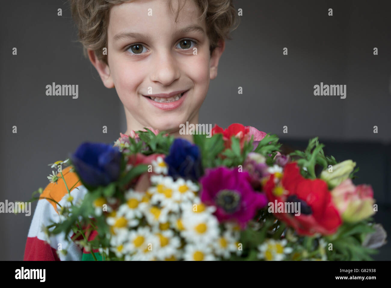 Close up boy holding flowers hi-res stock photography and images - Alamy