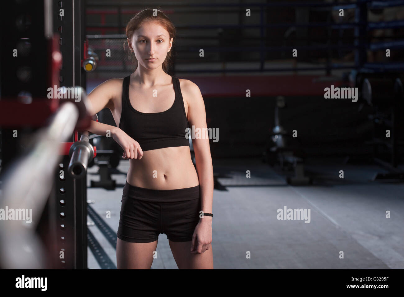 Portrait of athlete standing at gym Stock Photo - Alamy