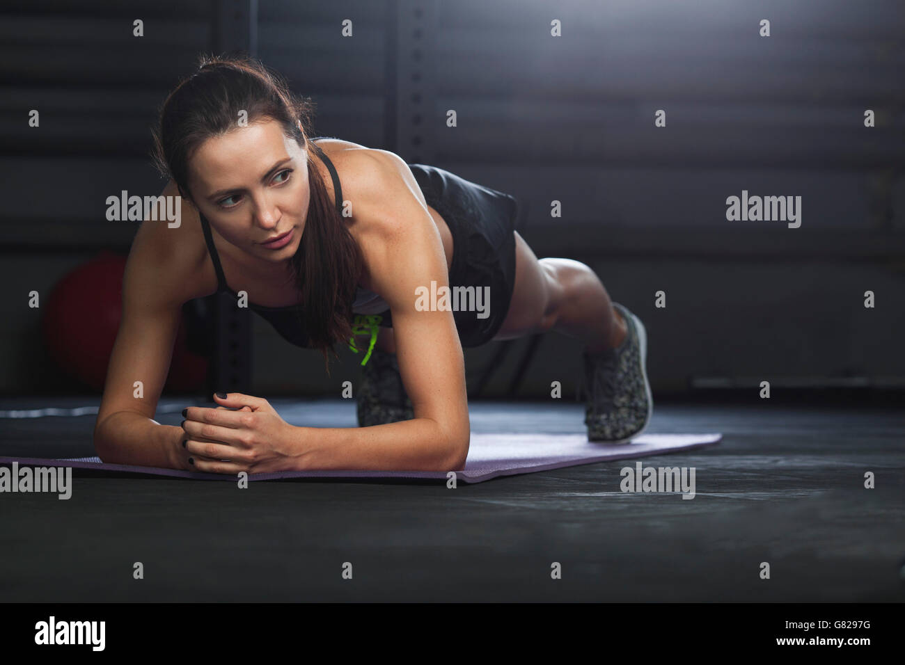 Muscular young woman exercising gym hi-res stock photography and images ...