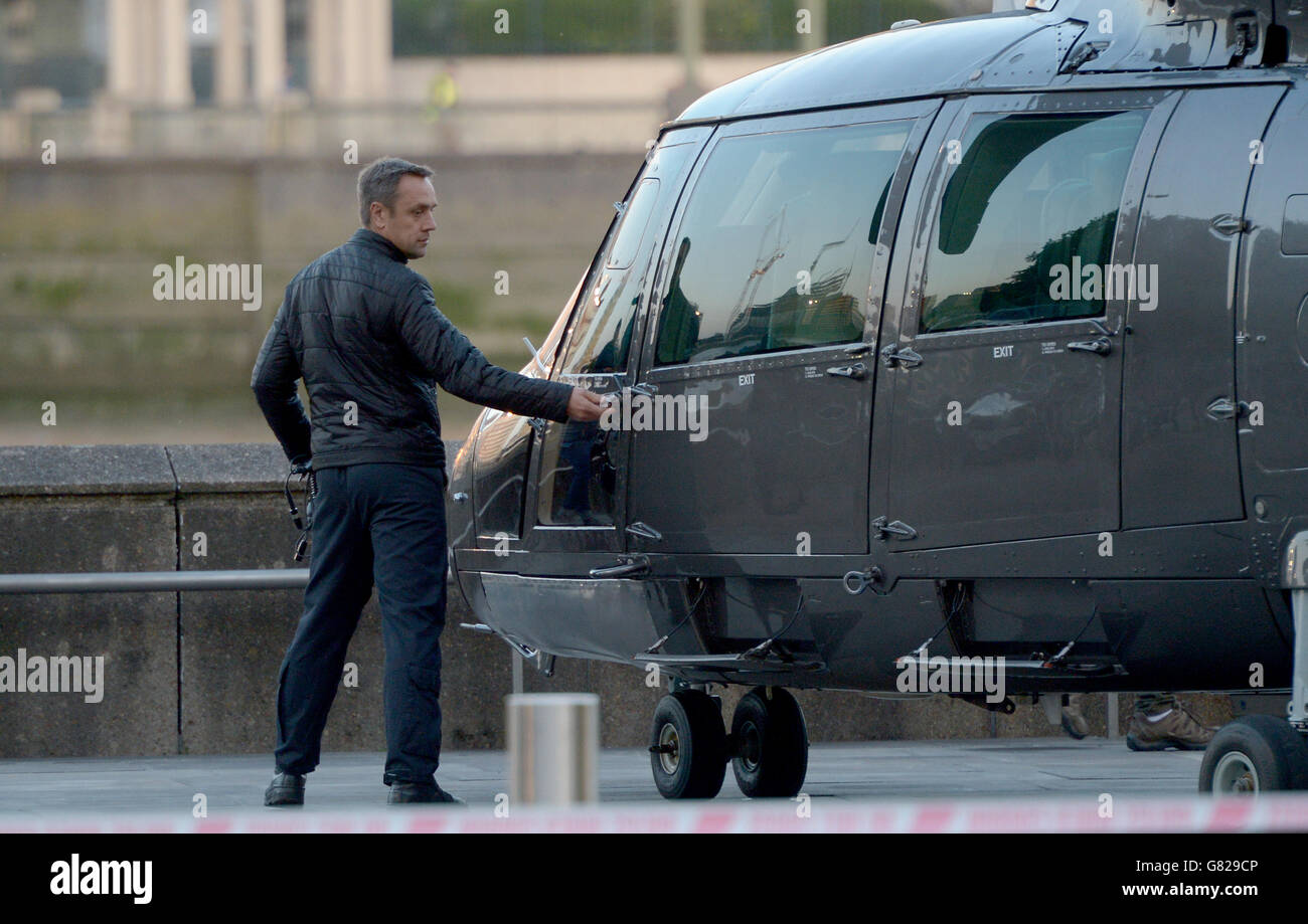 A pilot prepares to fly a helicopter during the filming of the new ...