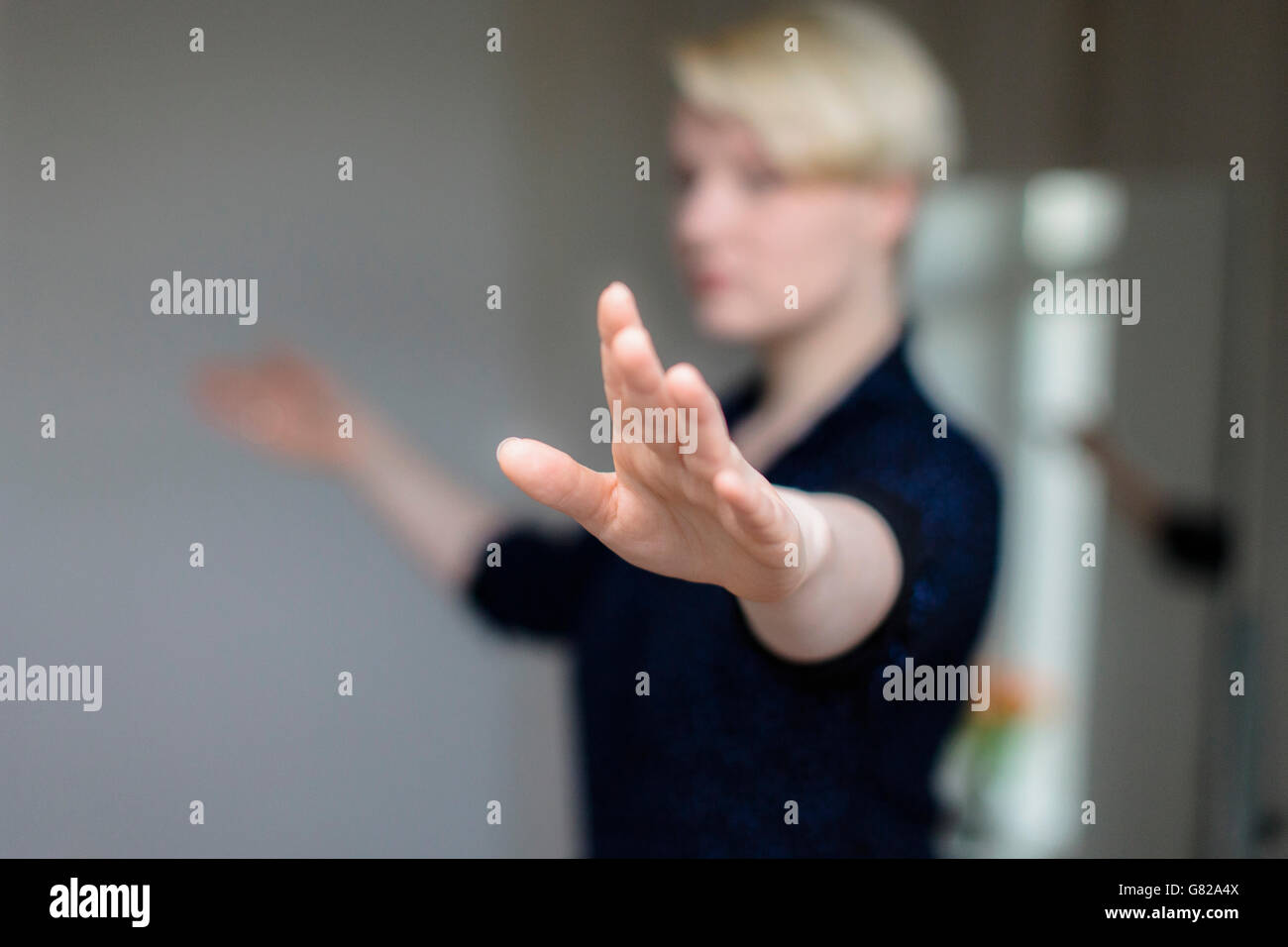 Woman practicing yoga arms outstretched hi-res stock photography and ...