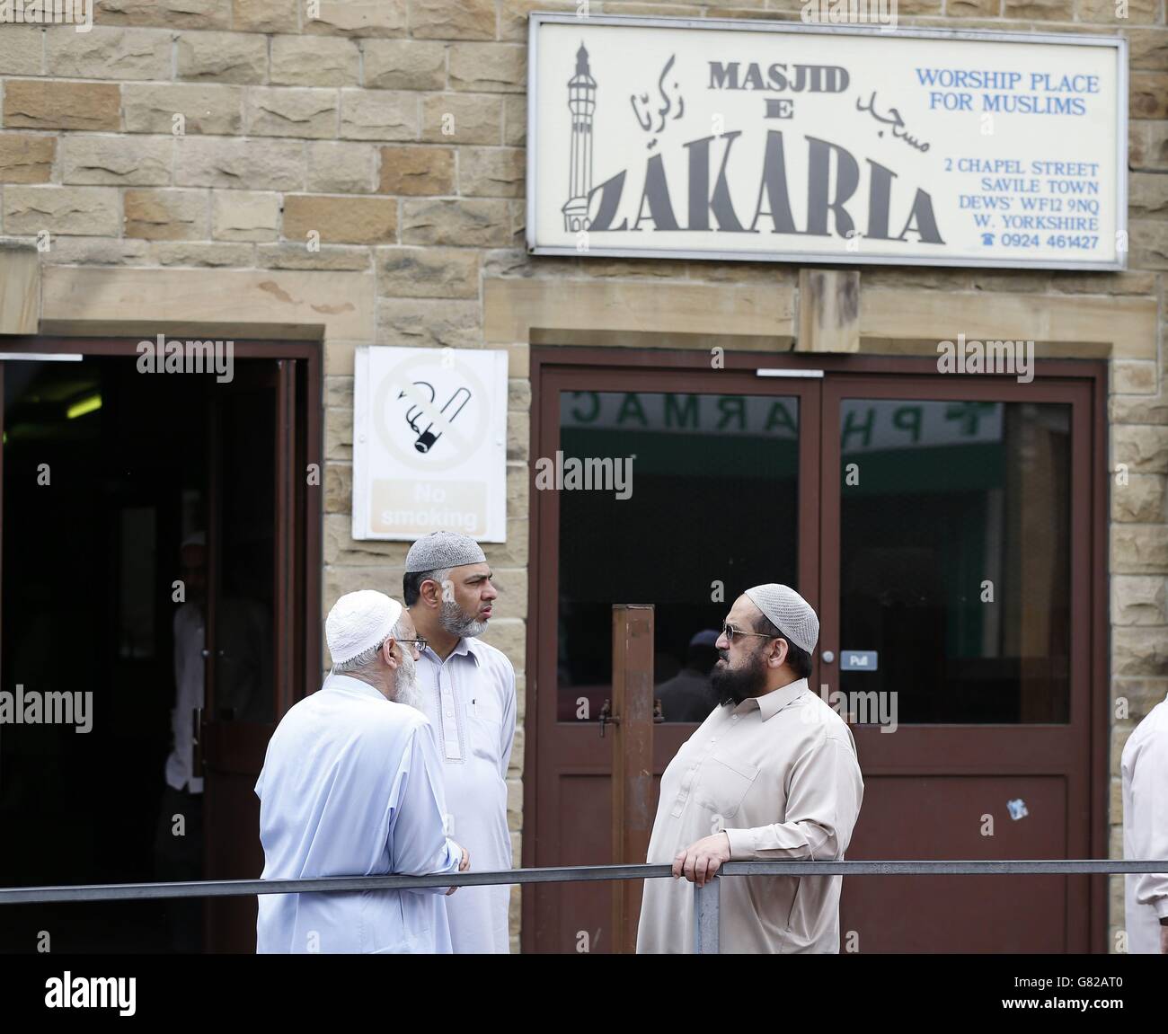 Men outside the Masjid E Zakaria Mosque, in Dewsbury, that Talha Asmal ...