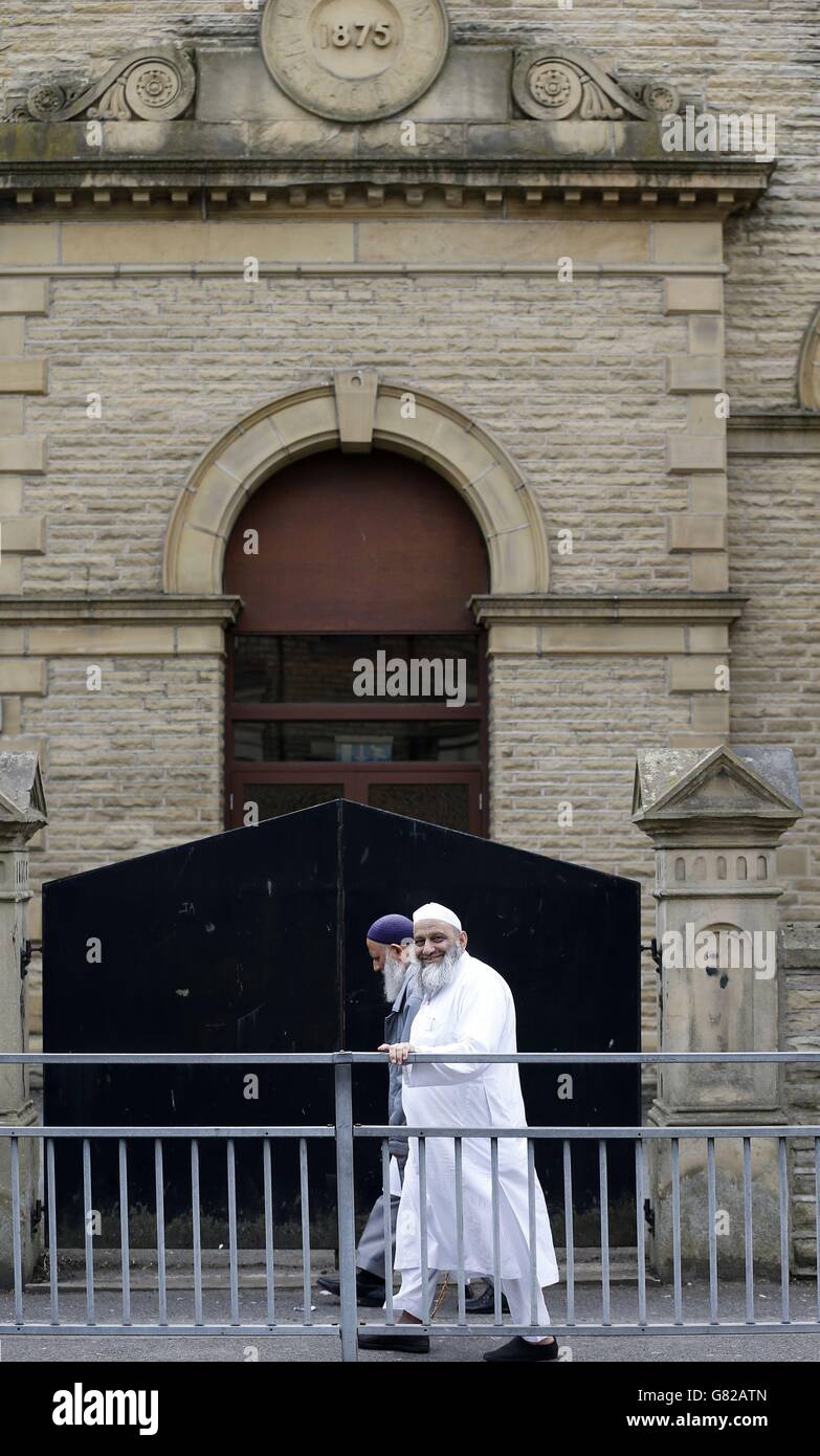 Men outside the Masjid E Zakaria Mosque, in Dewsbury, that Talha Asmal ...