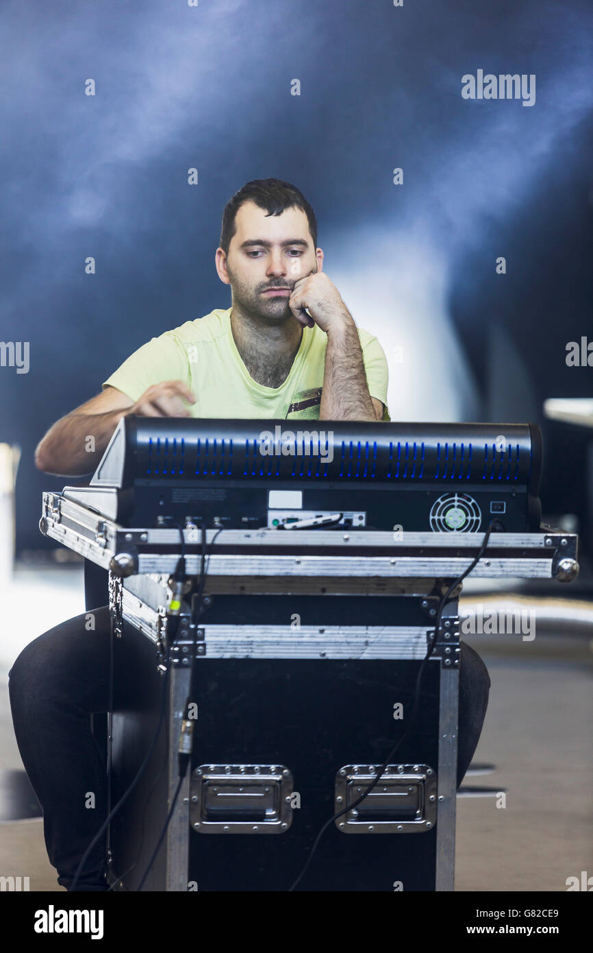Front view of man with sound mixer sitting in studio Stock Photo - Alamy