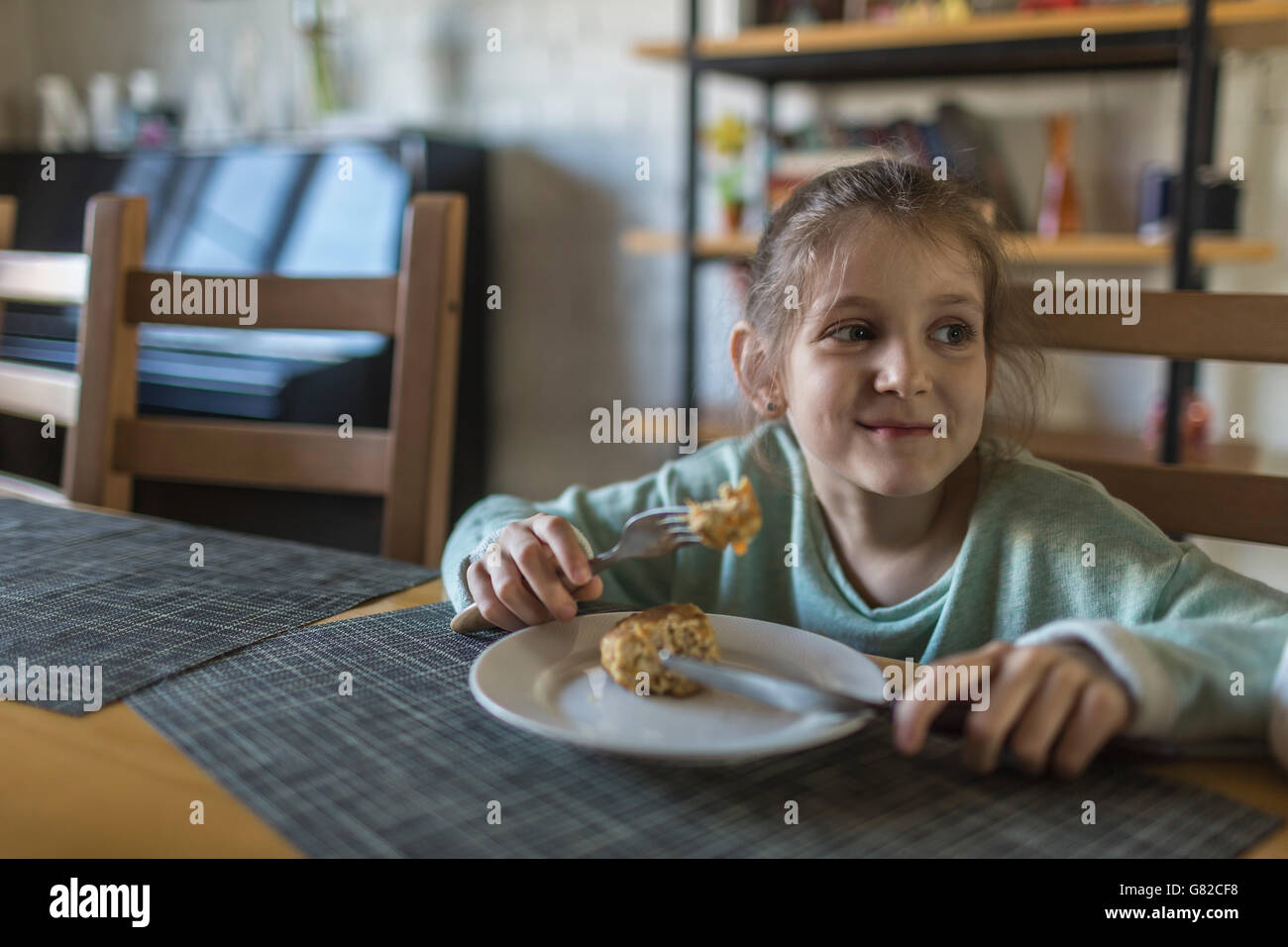 Sitting by table hi-res stock photography and images - Alamy