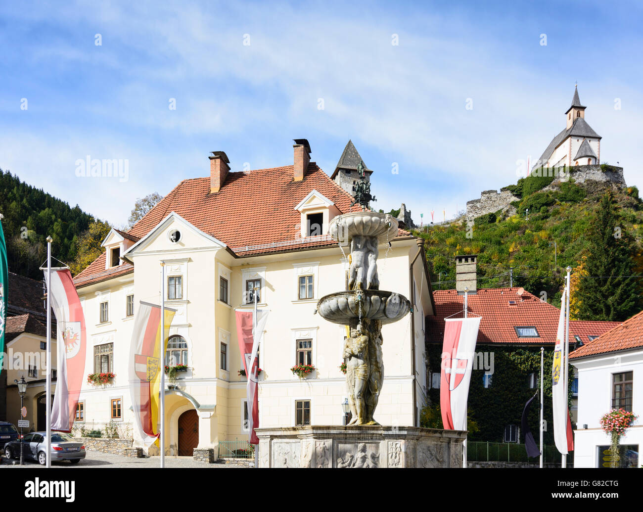 town hall , fountain and ruins Petersberg Castle, Friesach, Austria ...