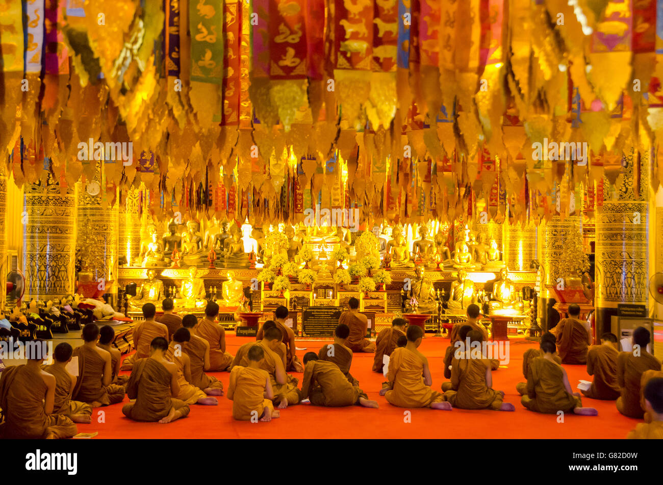 Rear view of monks sitting in Wat Chedi Luang temple Stock Photo - Alamy