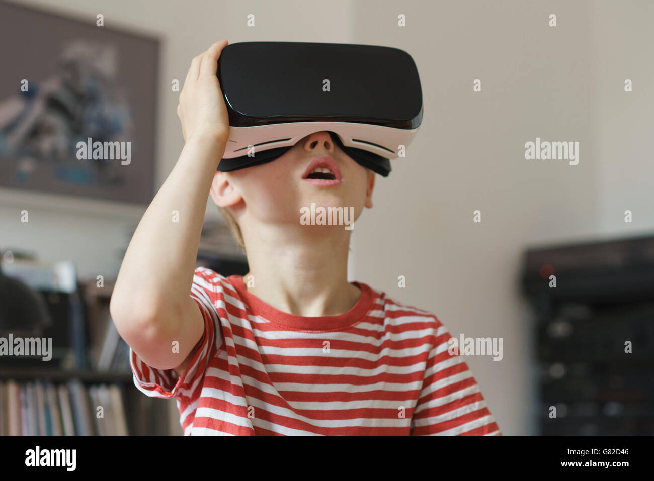 Boy wearing striped shirt hi-res stock photography and images - Alamy