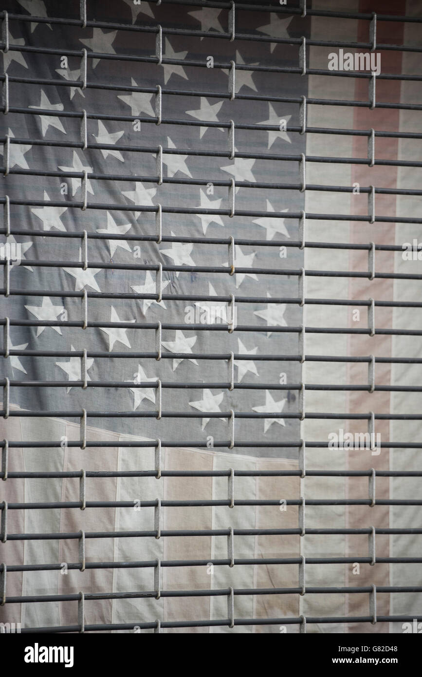 Full frame shot of American flag behind metal window Stock Photo - Alamy