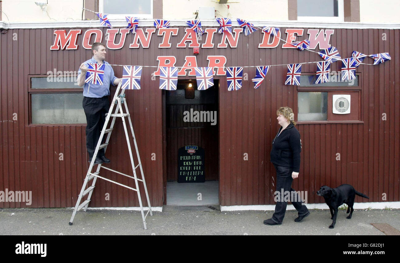 Callum Reid (left) stands outside the Mountain Dew Bar, taking down ...