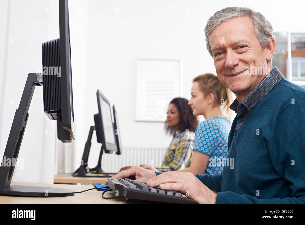 Mature Man Attending Computer Class Stock Photo - Alamy