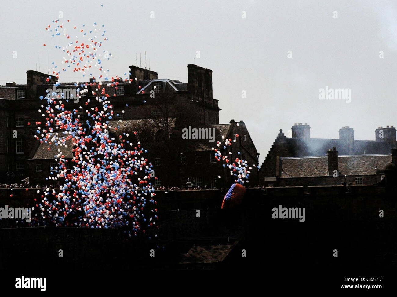 Thousands of red, white and blue balloons fill the sky over Edinburgh ...