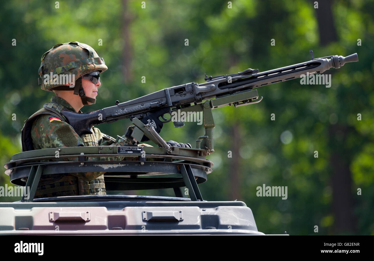 BURG / GERMANY - JUNE 25, 2016: german soldier secures with machine gun ...