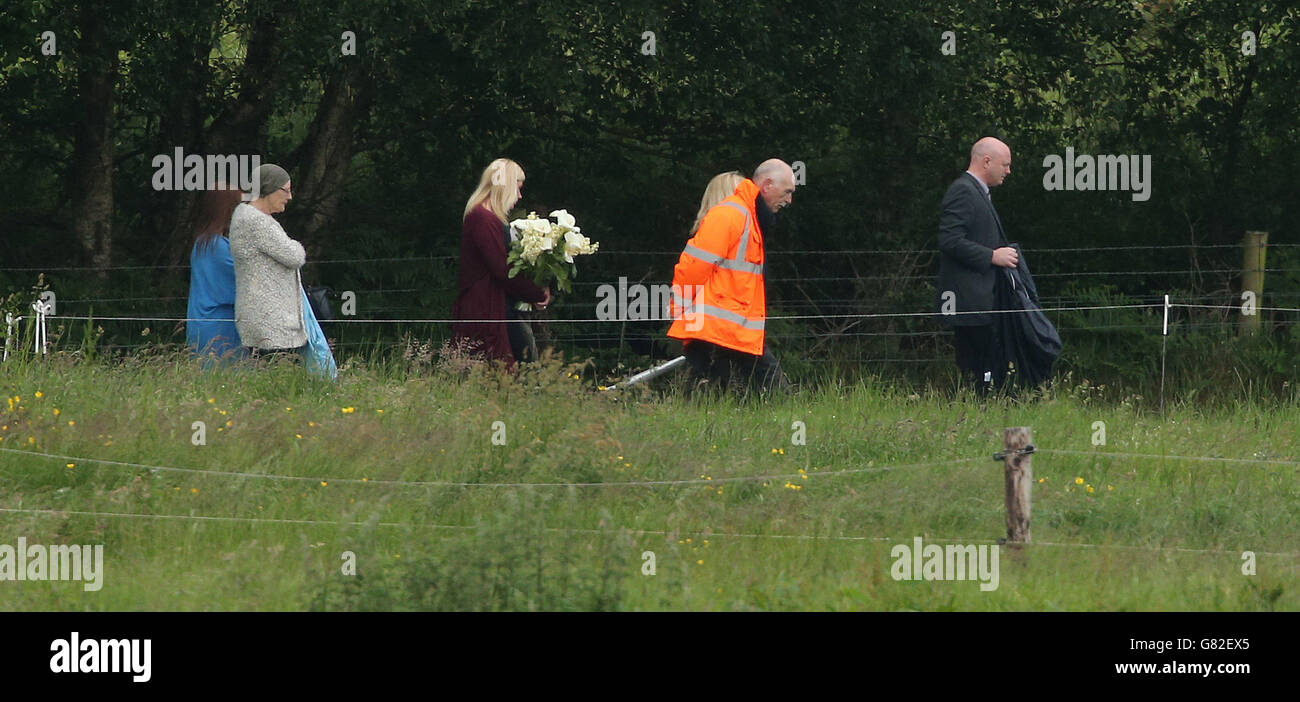 Geoff Knupfer (wearing orange jacket), head of the investigation team ...