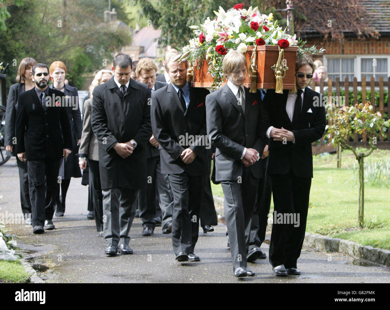 Mourners follow the coffin of Sir John Mills at the funeral of the ...