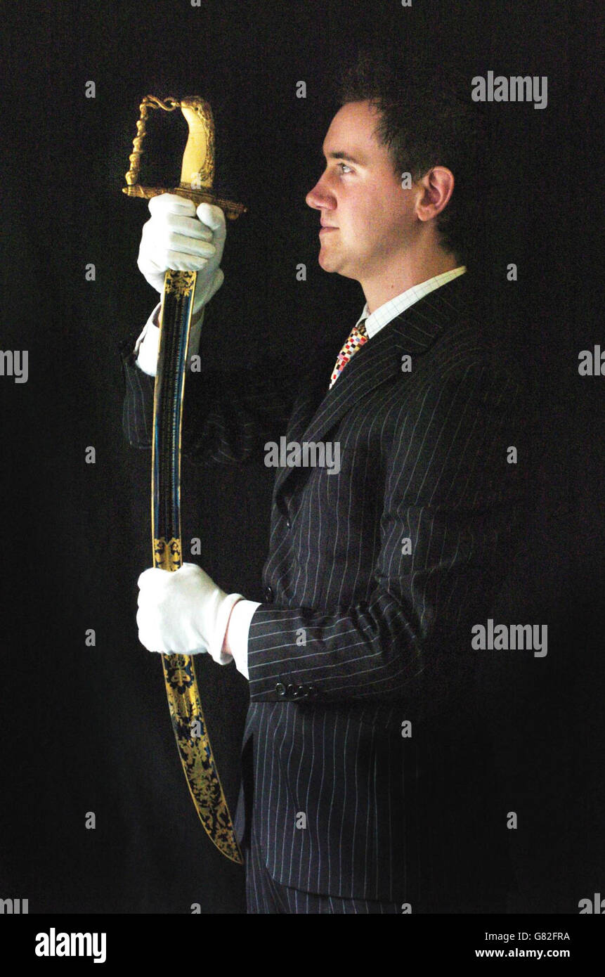 Andrew Robb of Bonhams auctioneers examines a rare Lloyd's Patriotic ...