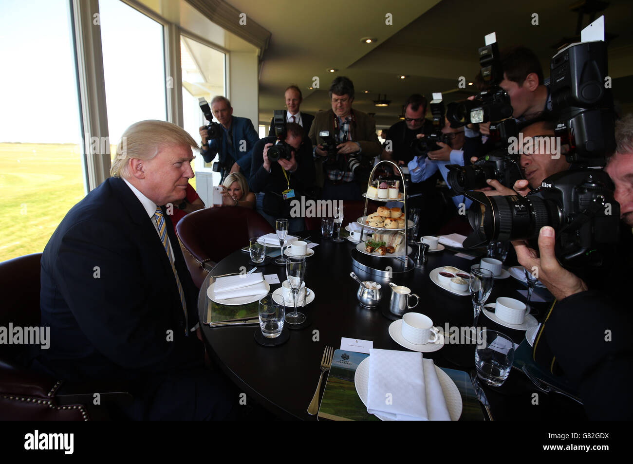 Donald Trump looks out from the"Duel in the Sun" restaurant after ...
