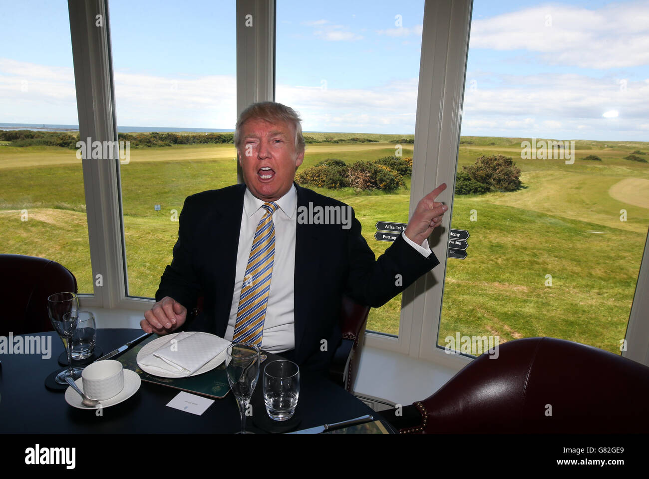 Donald Trump looks out from the"Duel in the Sun" restaurant after ...