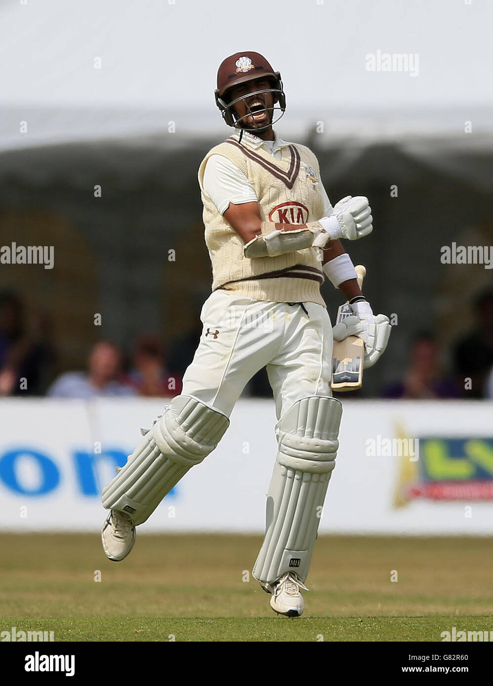 Surrey's Arun Harinath celebrates after reaching his century against ...