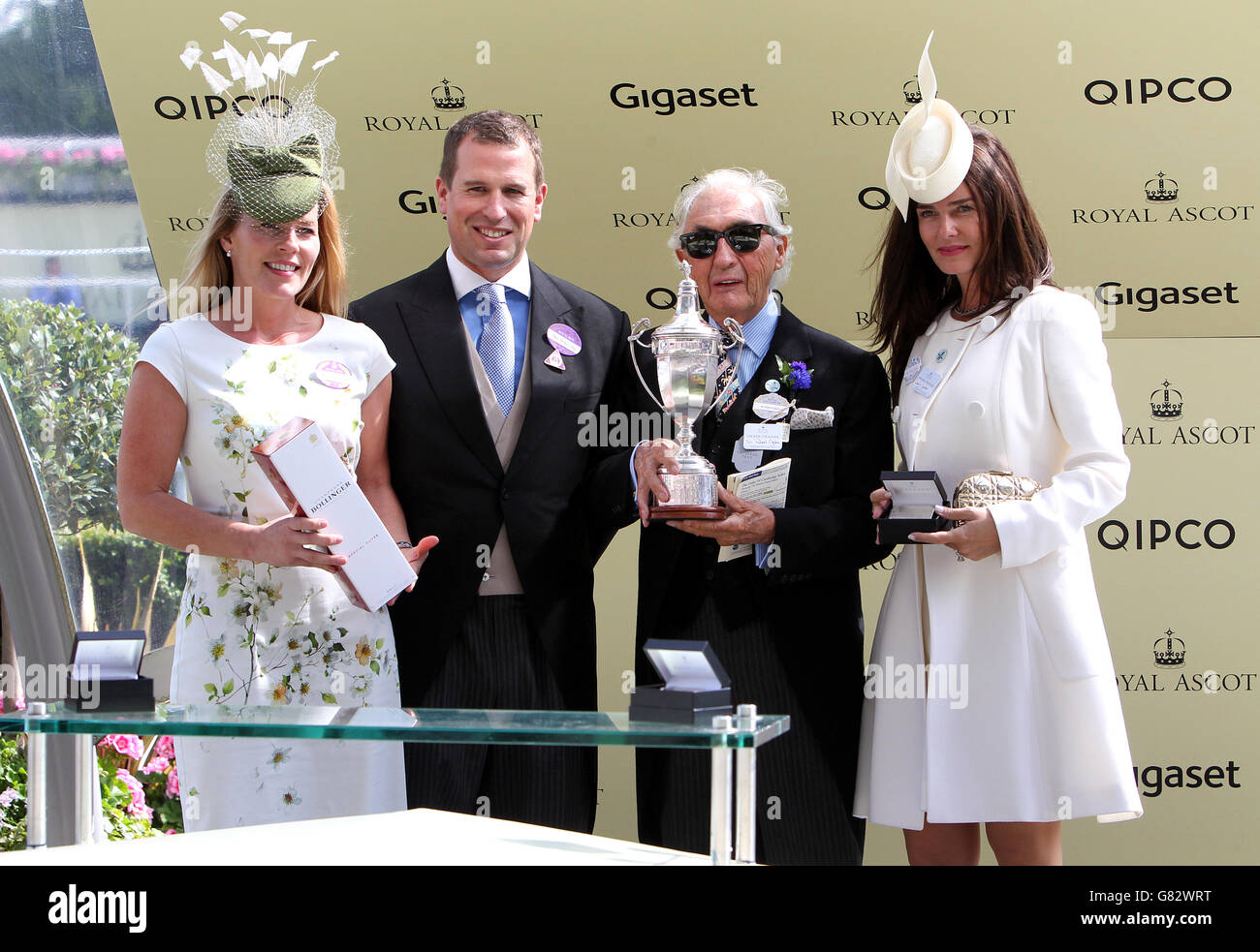 Winning owner Sir Robert Ogden (right) holds the trophy alongside Peter ...