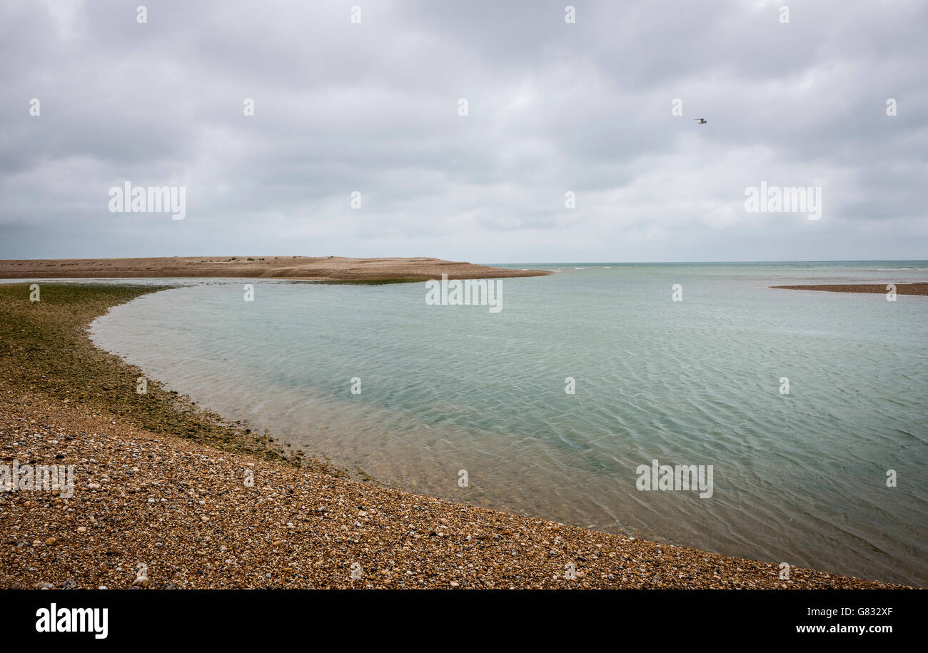 The shingle spit at the entrance to Pagham harbour near Chichester ...