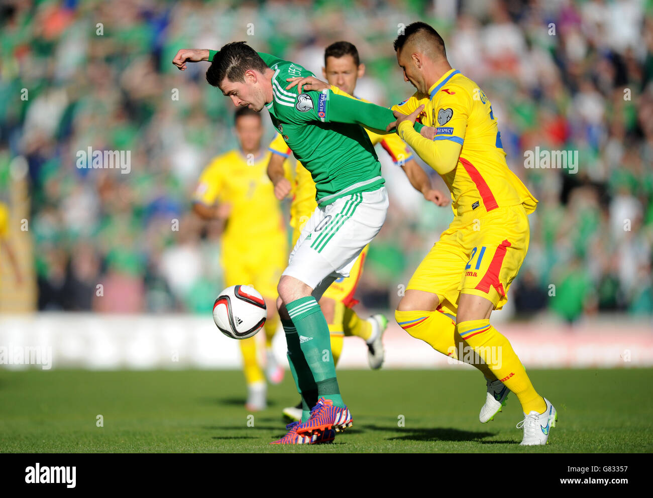 Northern Ireland's Kyle Lafferty and Romania's Dragos Grigore (right ...