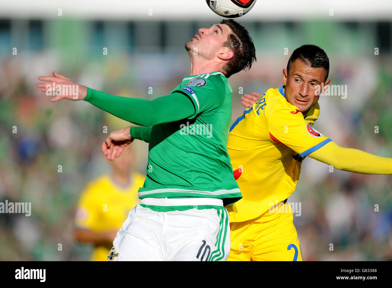 Northern Ireland's Kyle Lafferty and Romania's Dragos Grigore (right ...