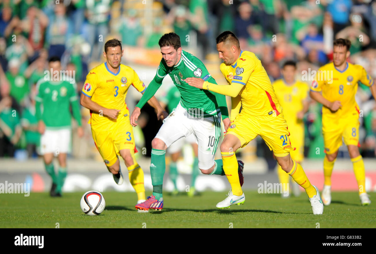 Northern Ireland's Kyle Lafferty and Romania's Dragos Grigore (right ...