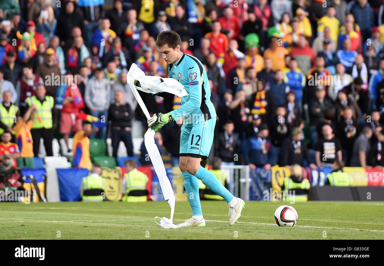 Romania goalkeeper Ciprian Tatarusanu clears toilet paper from the ...