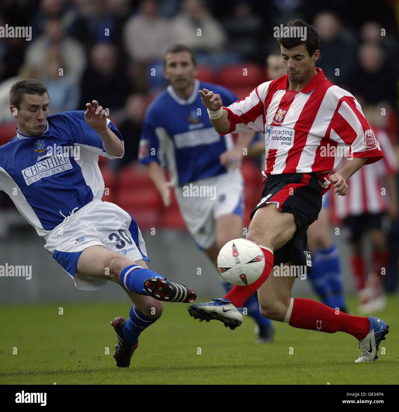 Lincoln City's Richard Butcher and Macclesfield Town's Kevin McIntyre ...