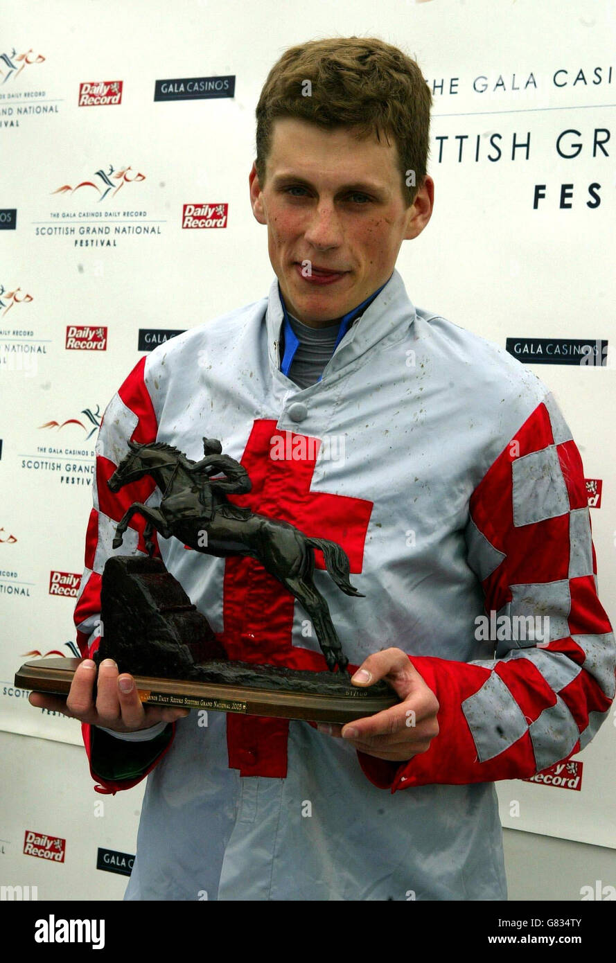 Jockey Keith Mercer with his trophy after riding Joes Edge to victory ...