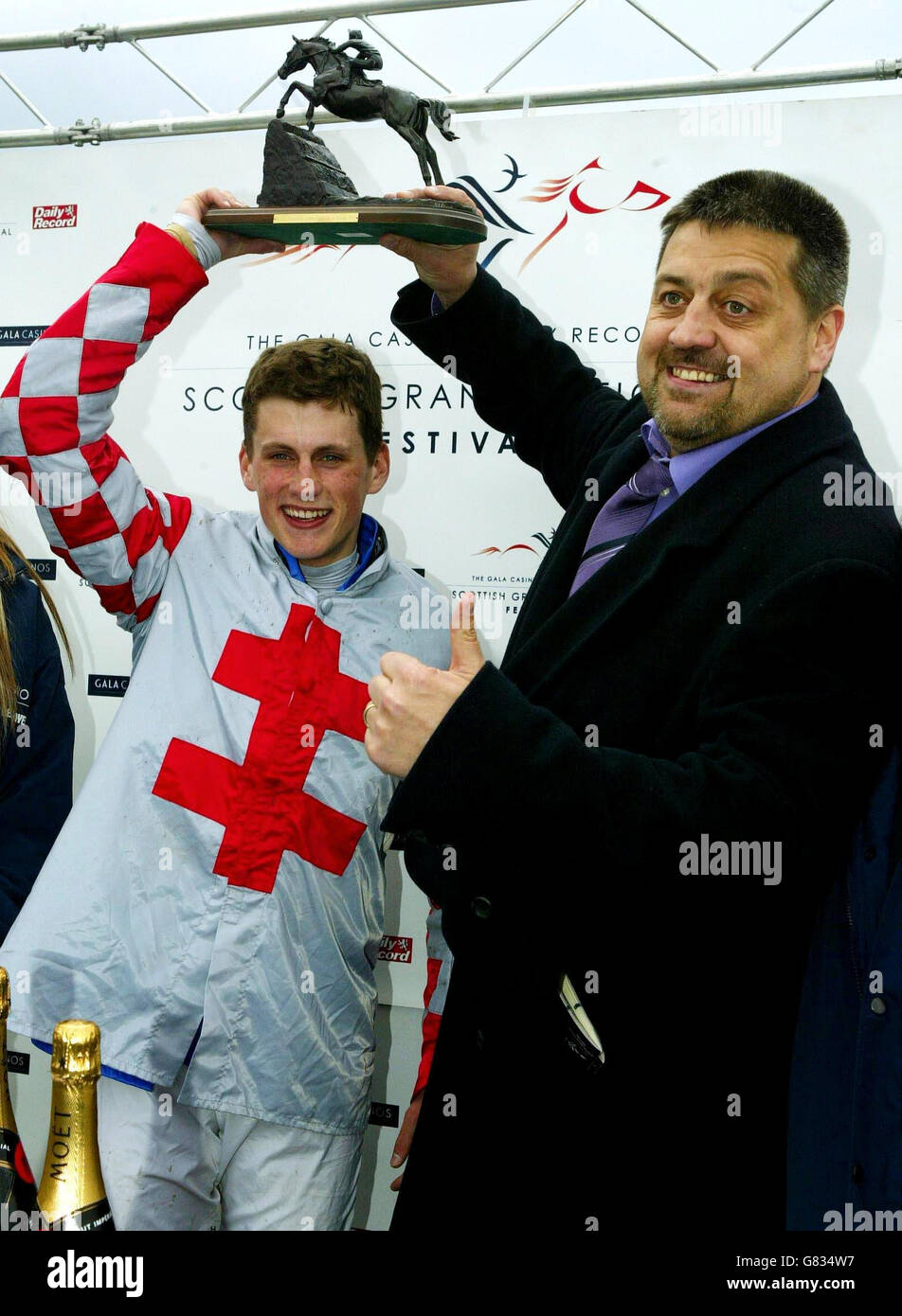 Jockey Keith Mercer and owner Chris Massie (R) celebrate with the ...