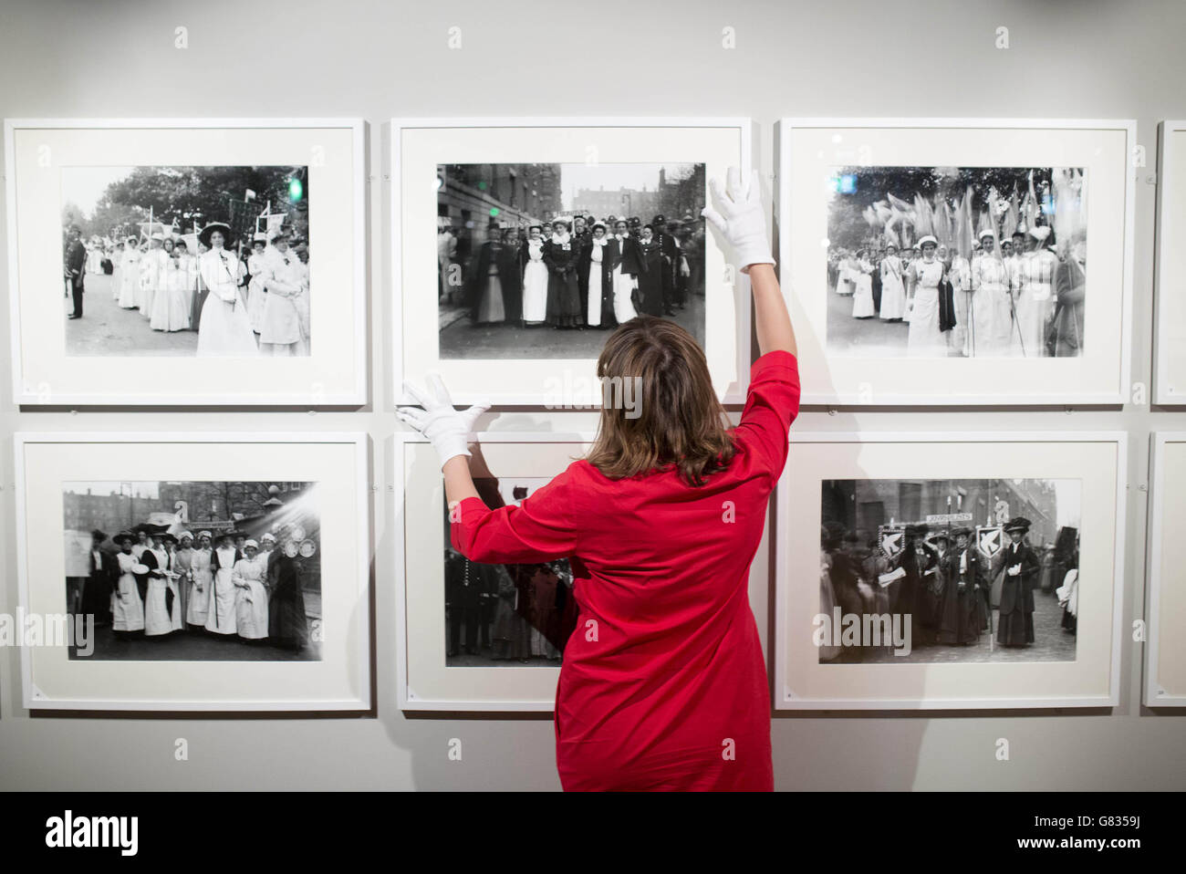 EDITORIAL USE ONLY Exhibition curator Anna Sparham inspects a display ...