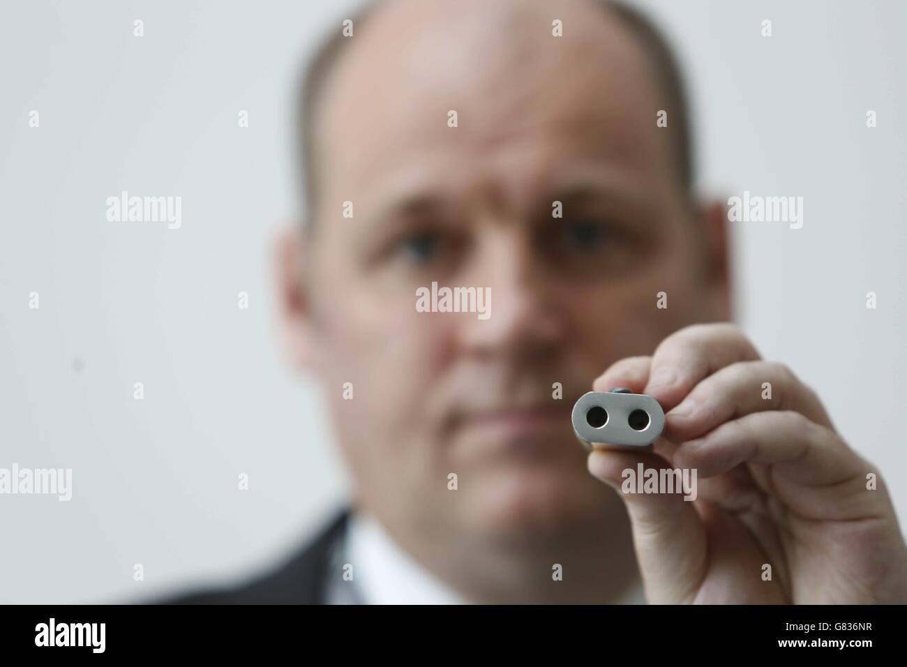 Detective Chief Superintendent John Cuddihy holds a home made gun ...