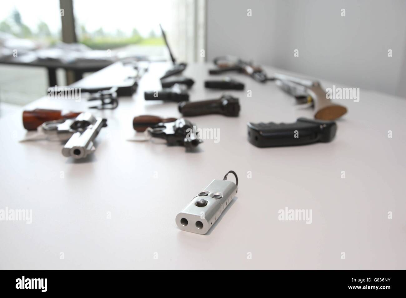 Various weapons seized in raids on display during a press briefing at ...