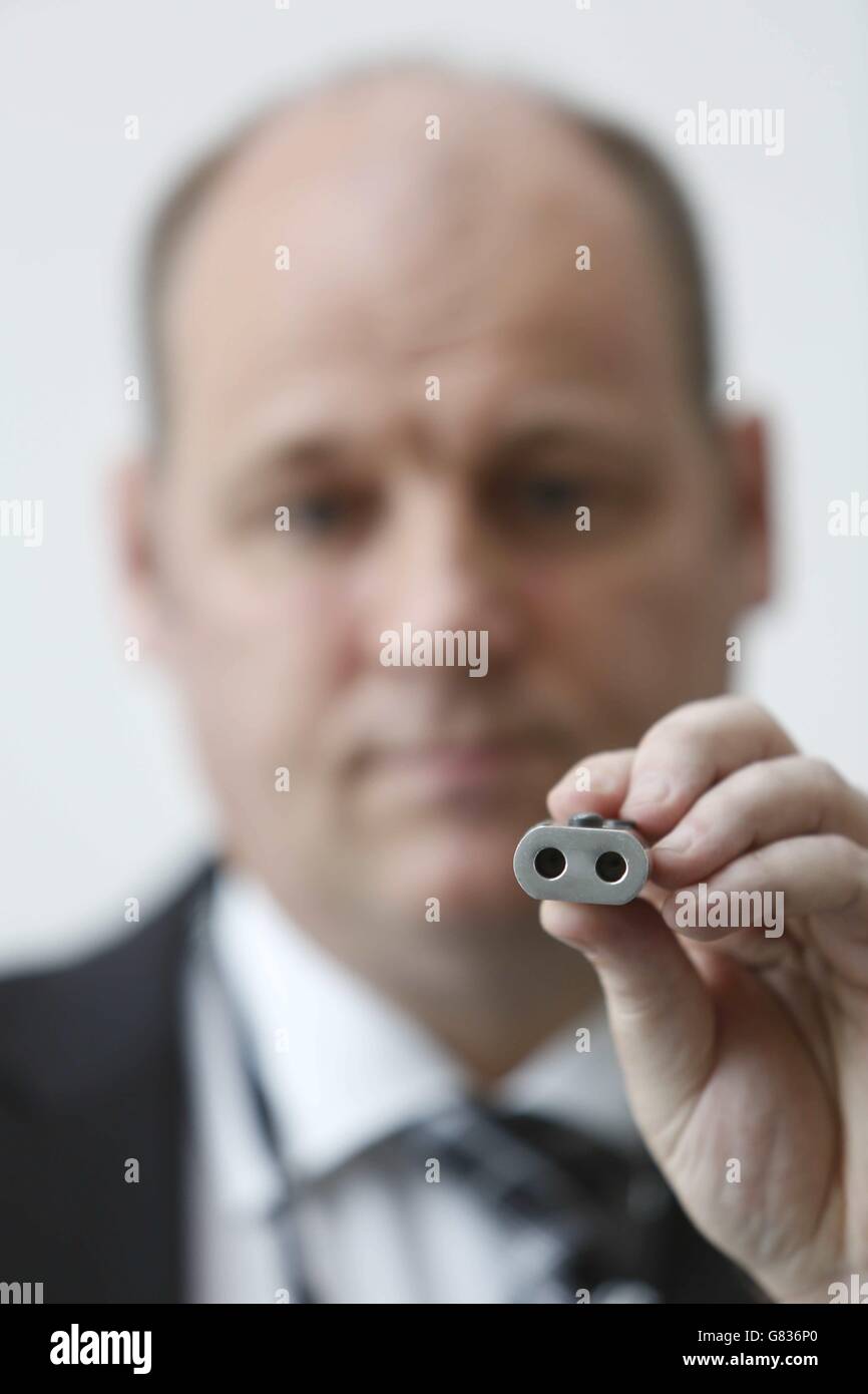 Detective Chief Superintendent John Cuddihy holds a home made gun ...