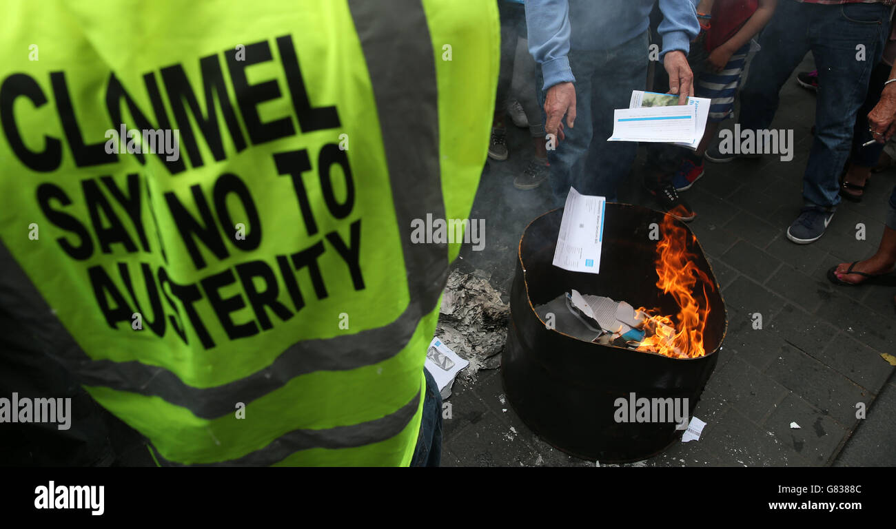 Protesters burn their water bills on O'Connell Street, Dublin, during a ...