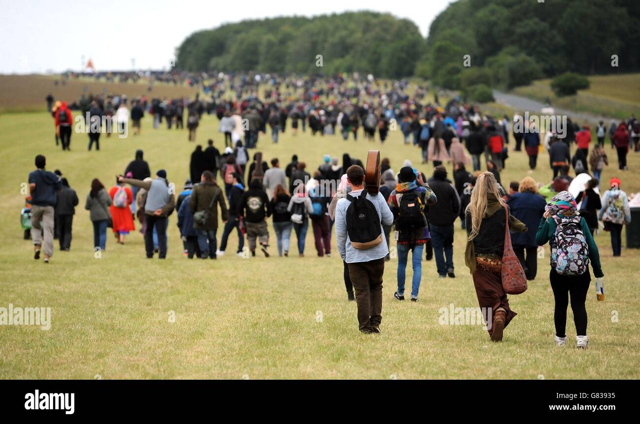 Crowds leave after sunrise at Stonehenge in Wiltshire, as thousands of ...