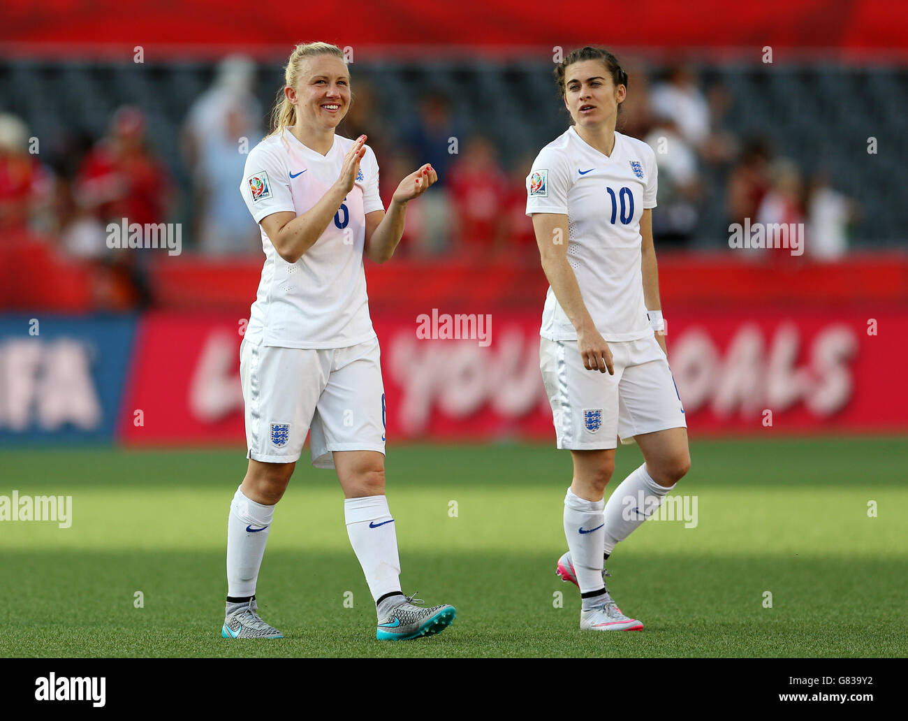 England's Laura Bassett and Karen Carney celebrate after the final ...